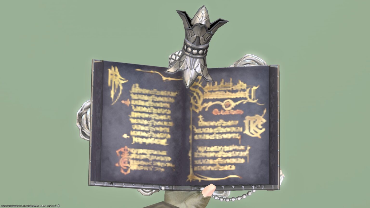 A book that looks like a silver accessory with a hole / The Scholar ...